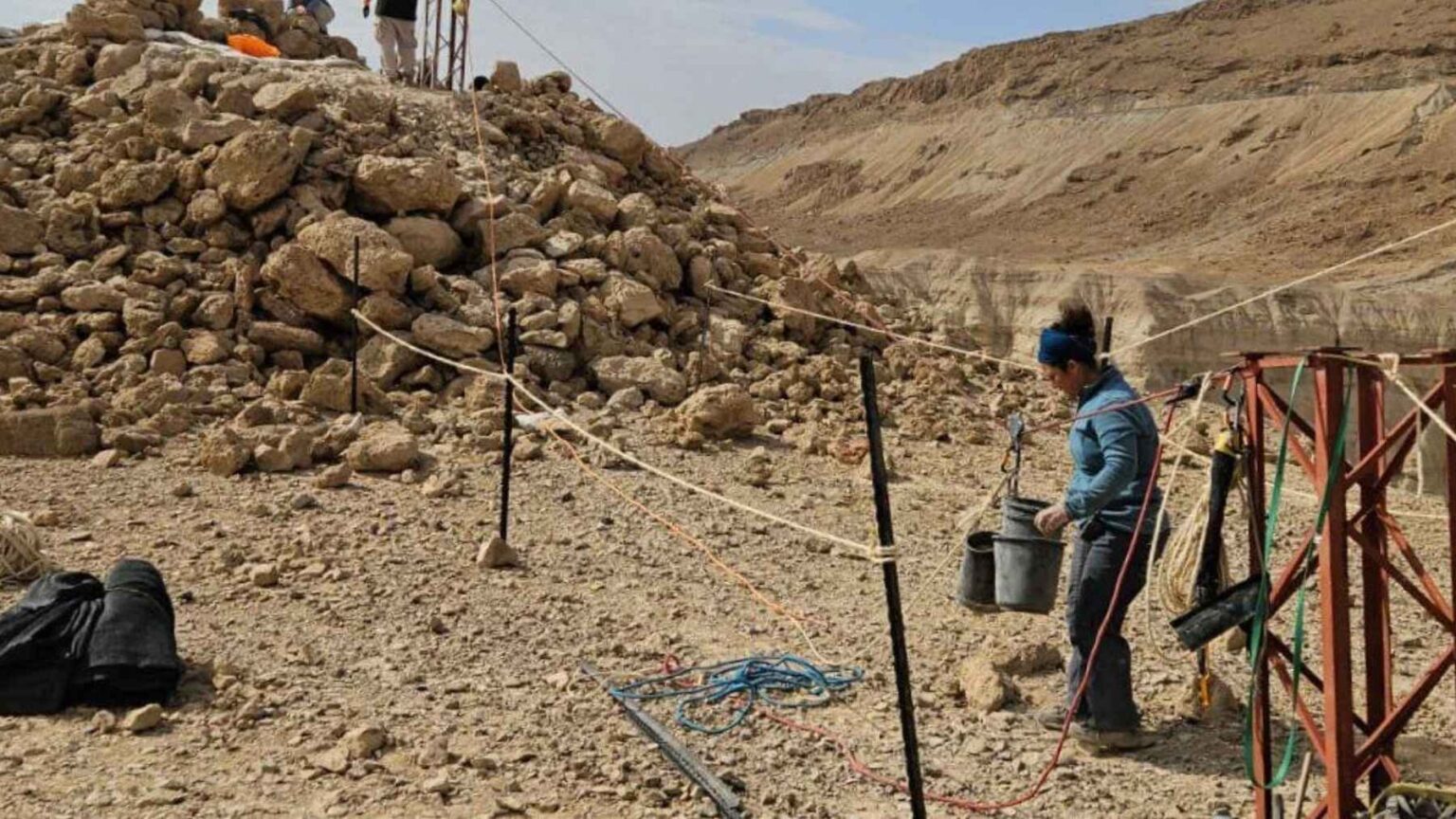 High above the Dead Sea, archaeologists are picking their way through a ...
