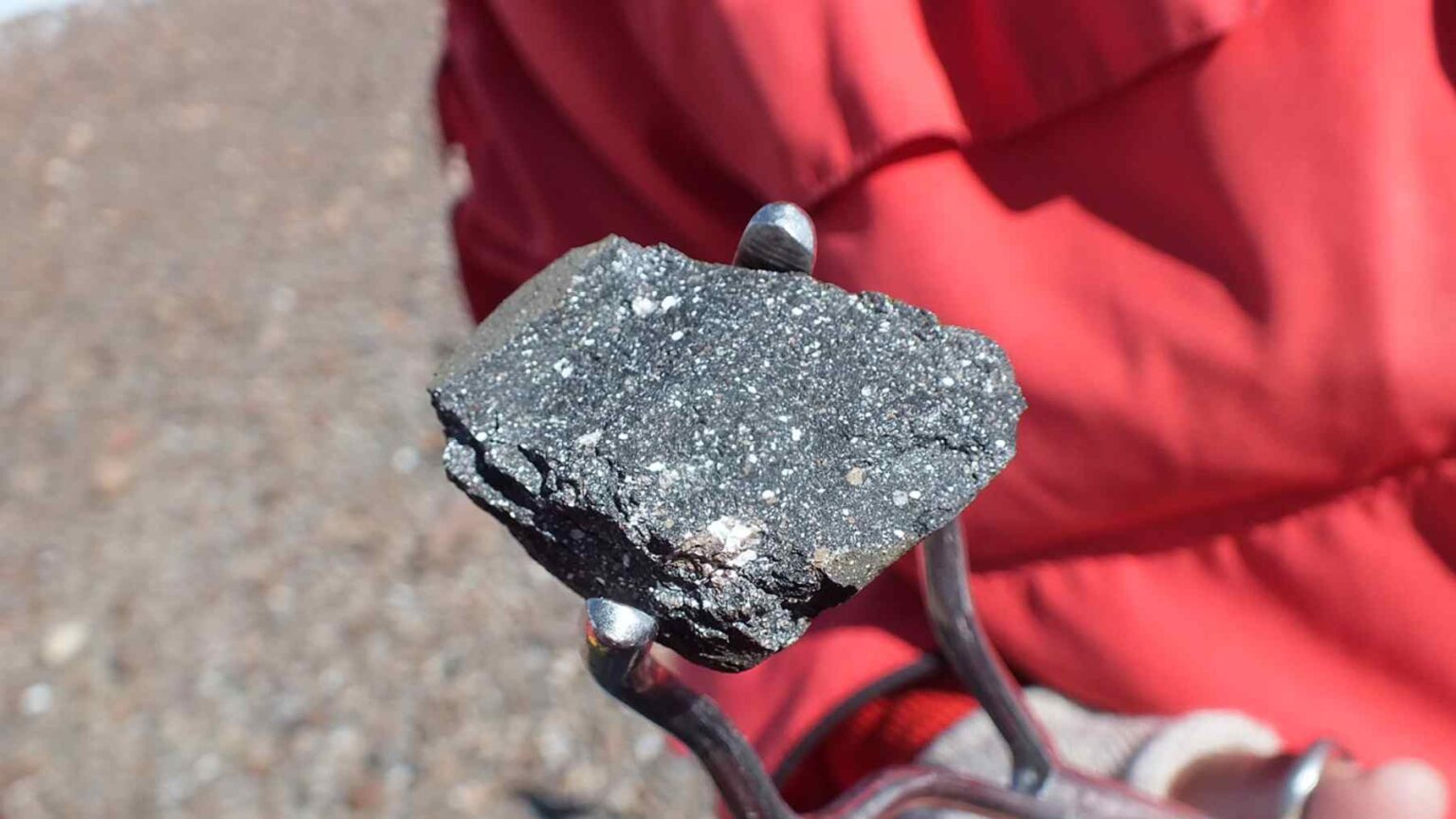 A small dark meteorite trapped in Antarctic ice could be pointing to ...